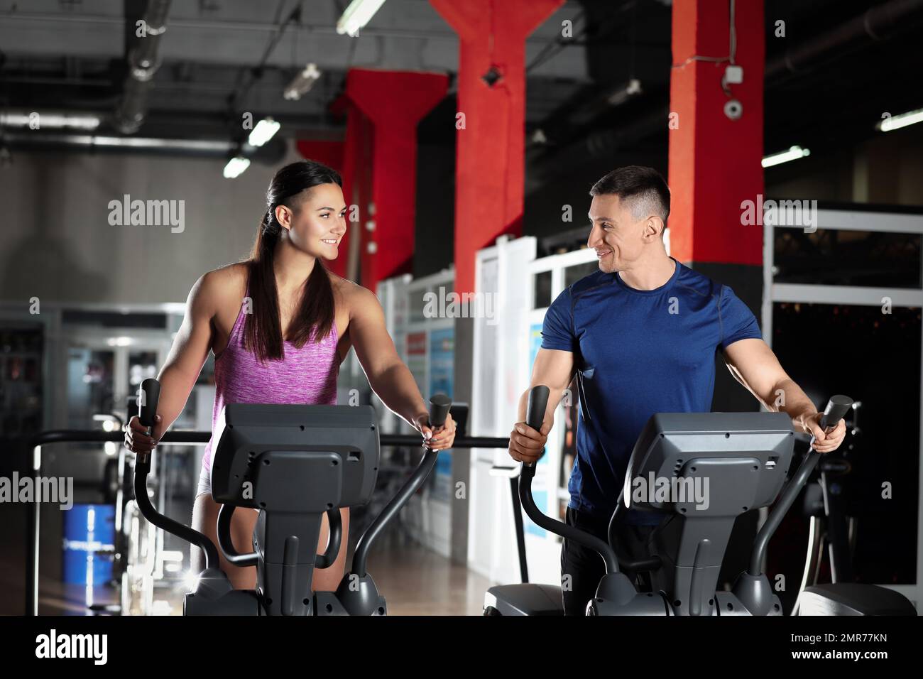 Woman working out on elliptical hi-res stock photography and images - Alamy