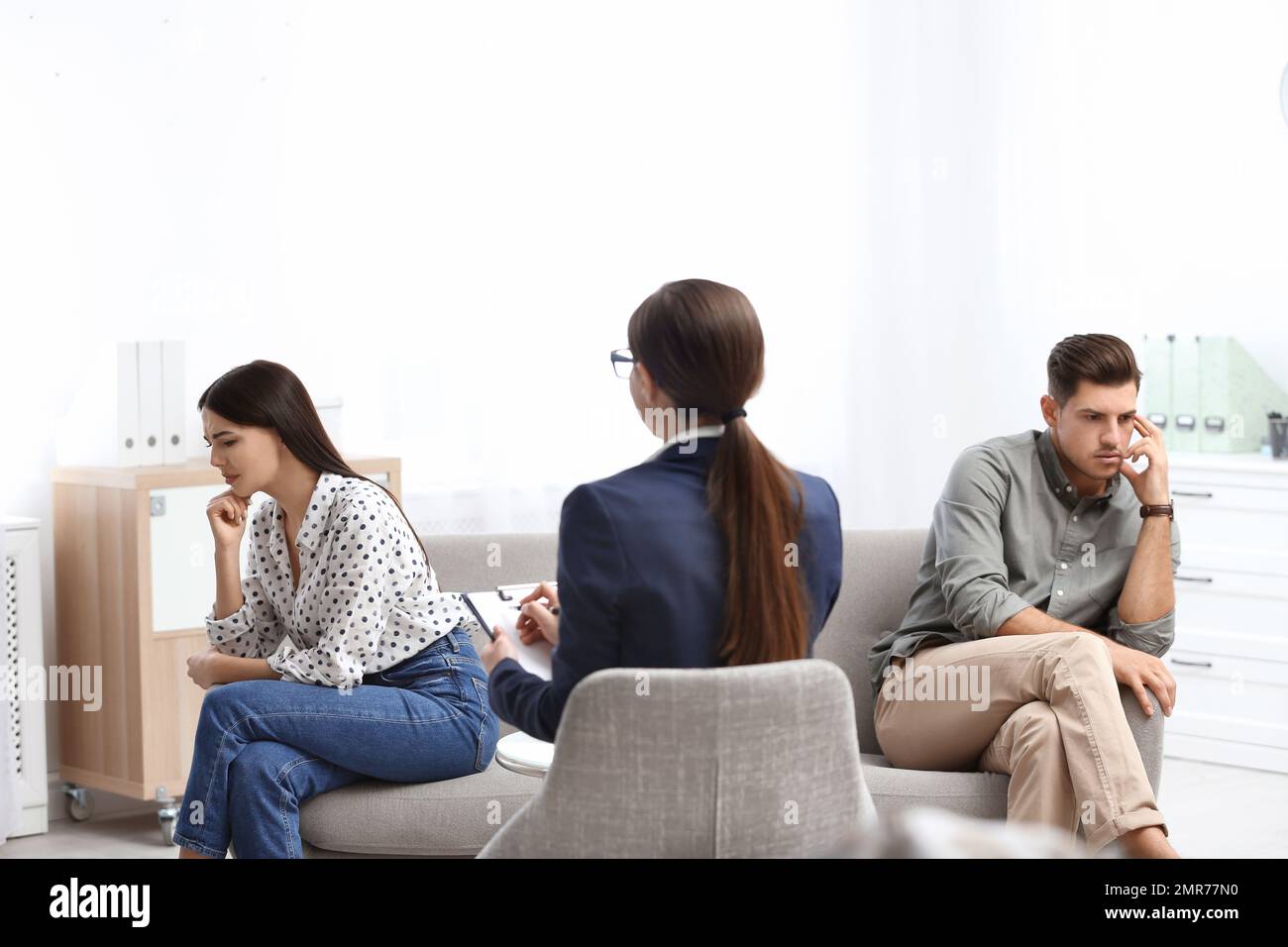 Professional psychologist working with couple in office Stock Photo - Alamy