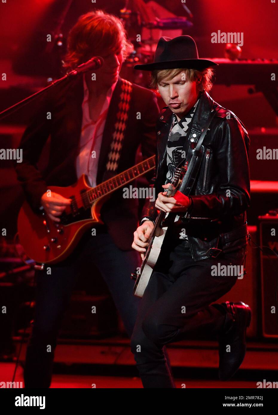 Singer-songwriter Beck, right, performs alongside band member Jason ...