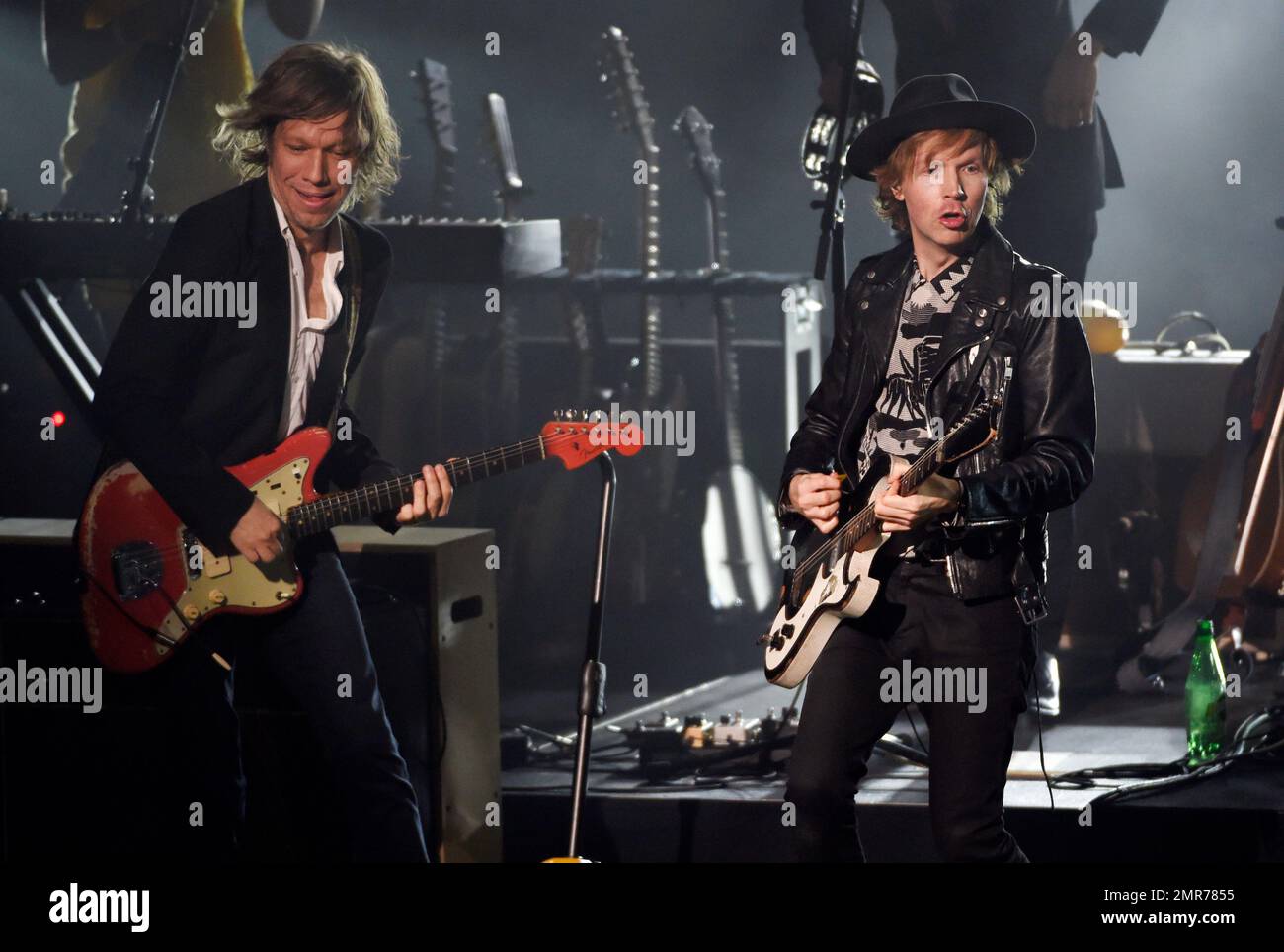 Singer-songwriter Beck, right, performs alongside band member Jason ...