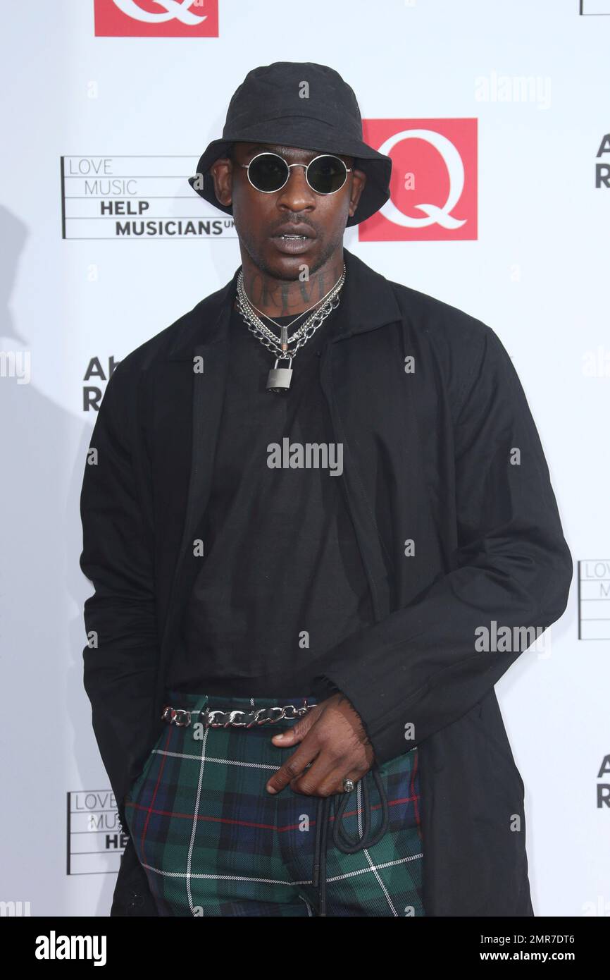 Rapper Skepta poses for photographers upon arrival at the Q Awards in ...