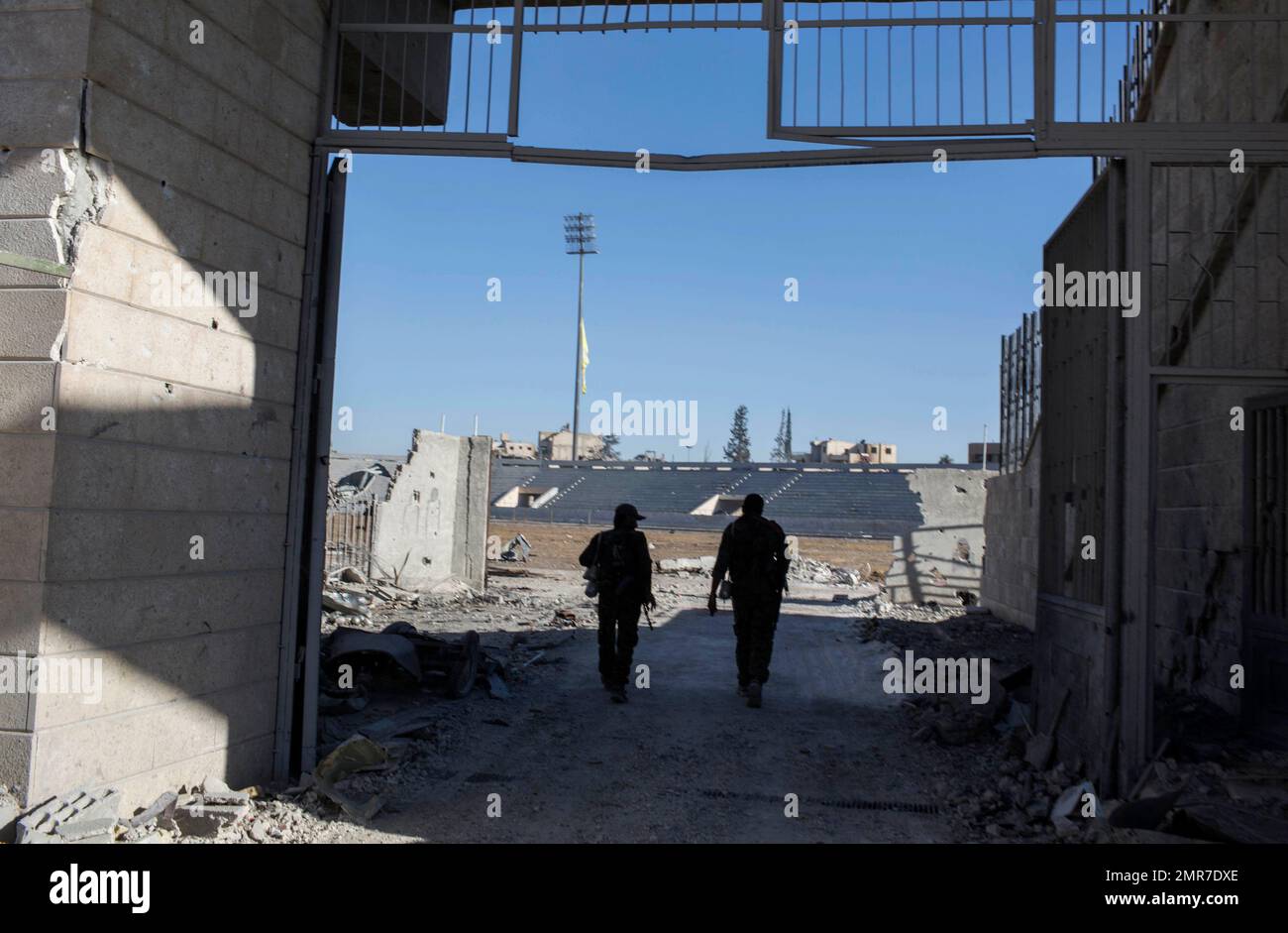 Members of the U.S.-backed Syrian Democratic Forces (SDF) enter the ...