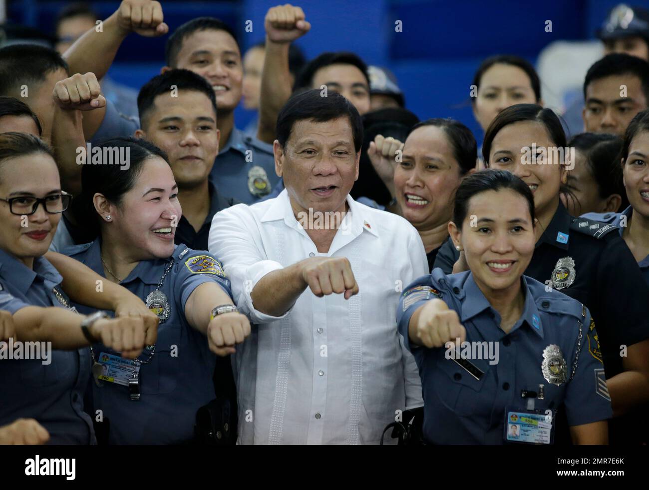 Philippine President Rodrigo Duterte, center, poses with members of the ...