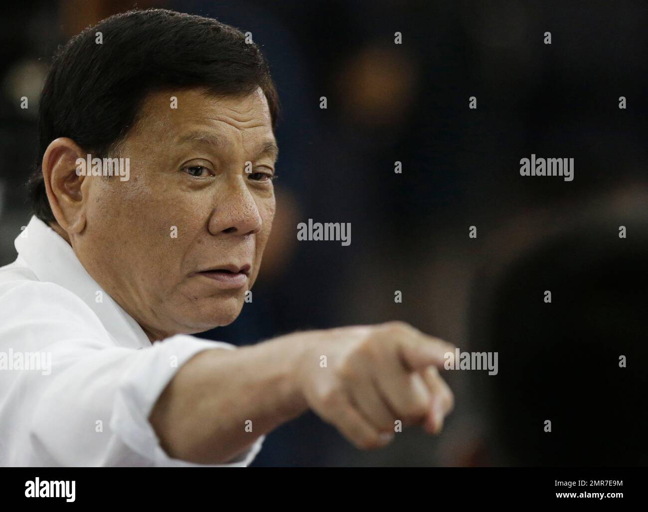 Philippine President Rodrigo Duterte gestures as he arrives to visit ...