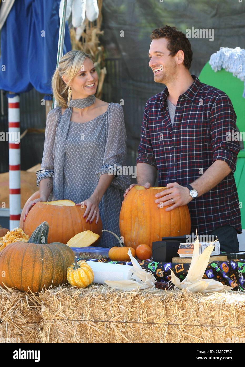 Heidi Klum carves a jack-o-lantern for Halloween during a visit to Mr ...