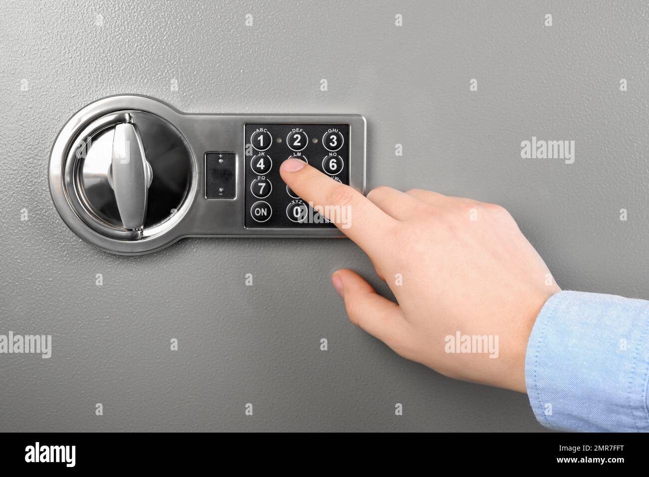 Man opening steel safe with electronic combination lock, closeup Stock ...