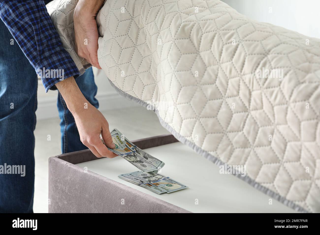 Money under mattress hi-res stock photography and images - Alamy