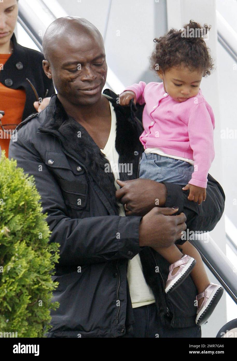 Heidi Klum and husband Seal ride the escalator with daughter Leni and ...