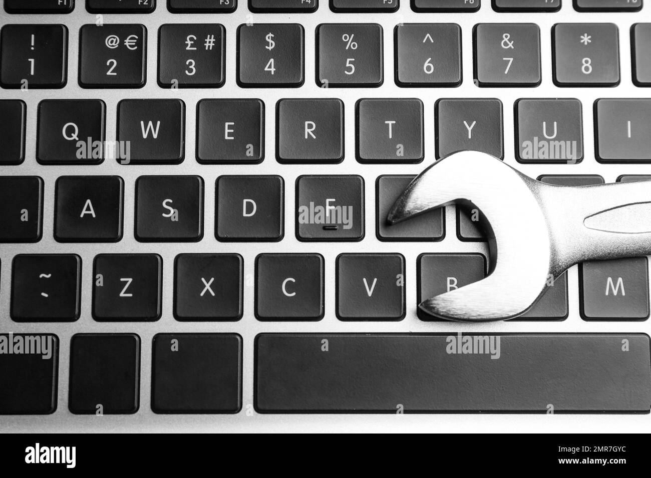 Spanner on laptop, top view. Concept of technical support Stock Photo ...