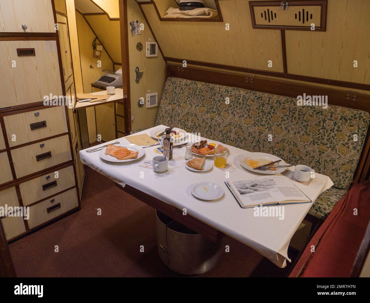 Dining table in a cabin inside HMS Ocelot in the Historic Dockyard ...