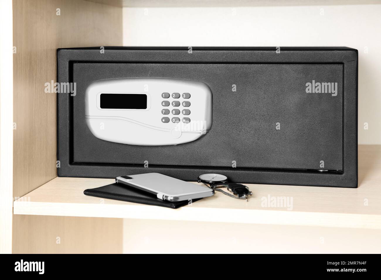 Black steel safe with electronic lock in wooden closet Stock Photo - Alamy