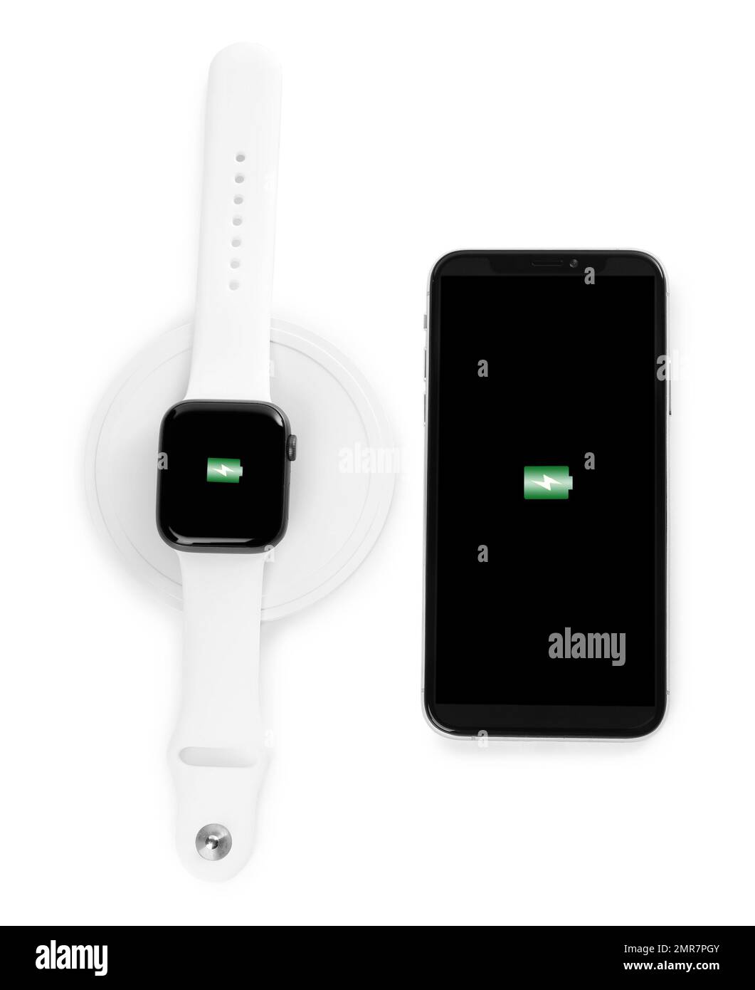 Smartwatch charging with wireless pad and mobile phone isolated on ...