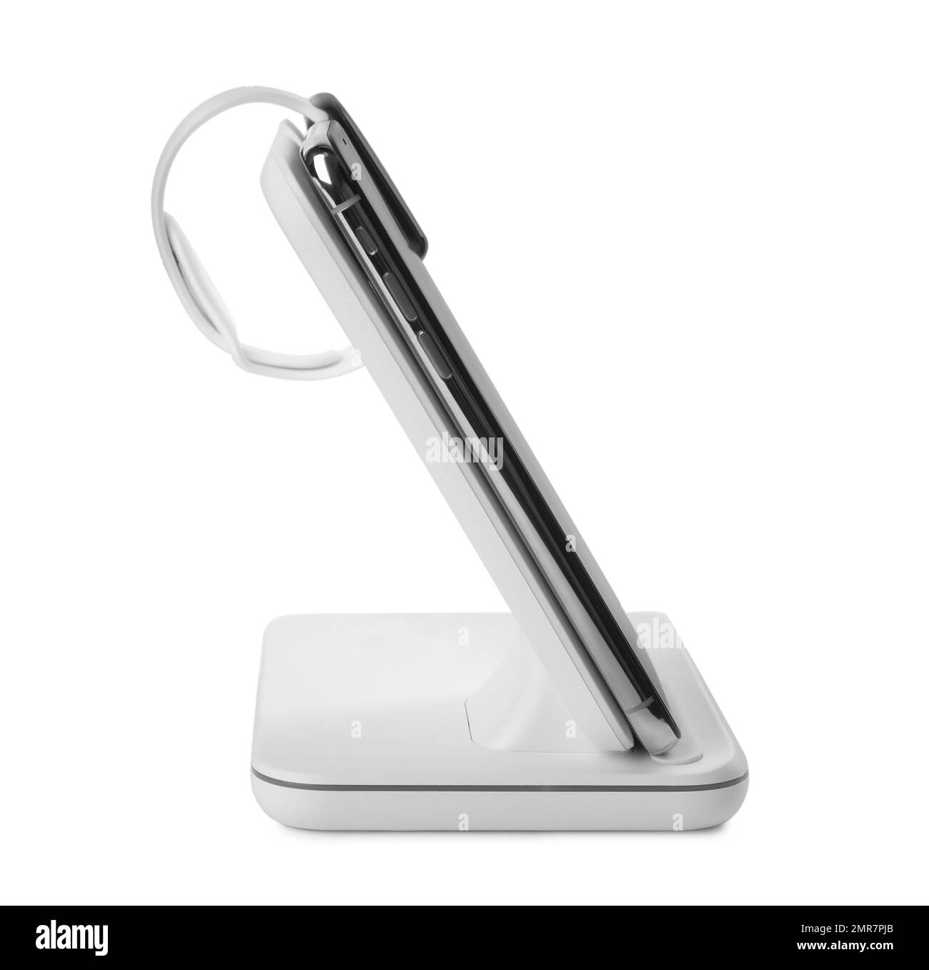 Mobile phone and smartwatch charging with wireless pad isolated on ...