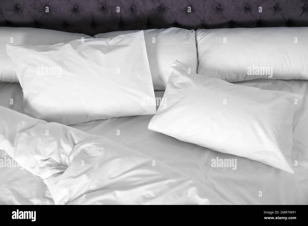 Bed with soft fluffy pillows at home, above view Stock Photo - Alamy