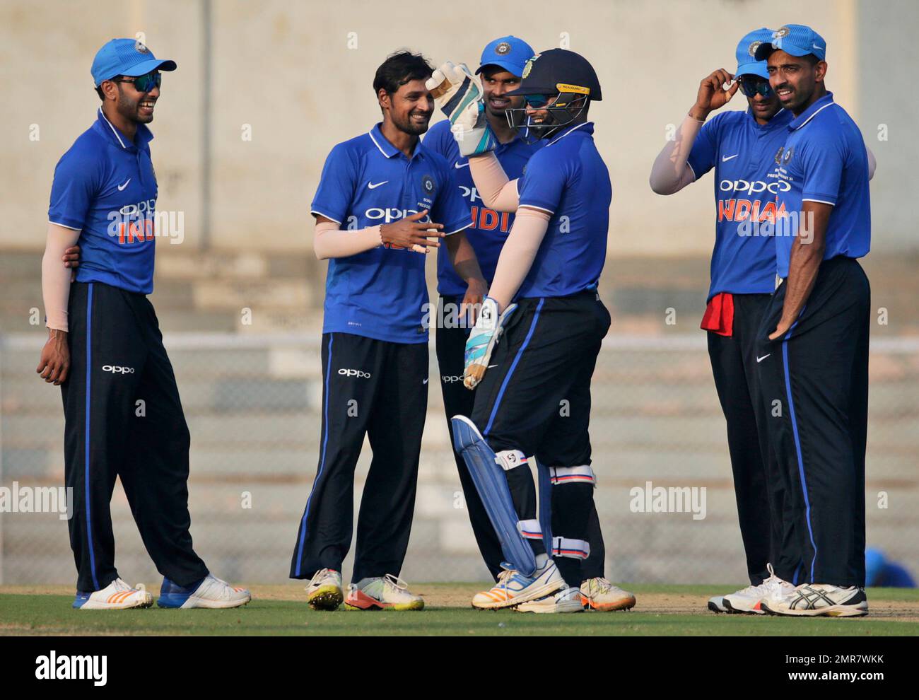 India A players celebrate the dismissal of New Zealand's Tim Southee ...