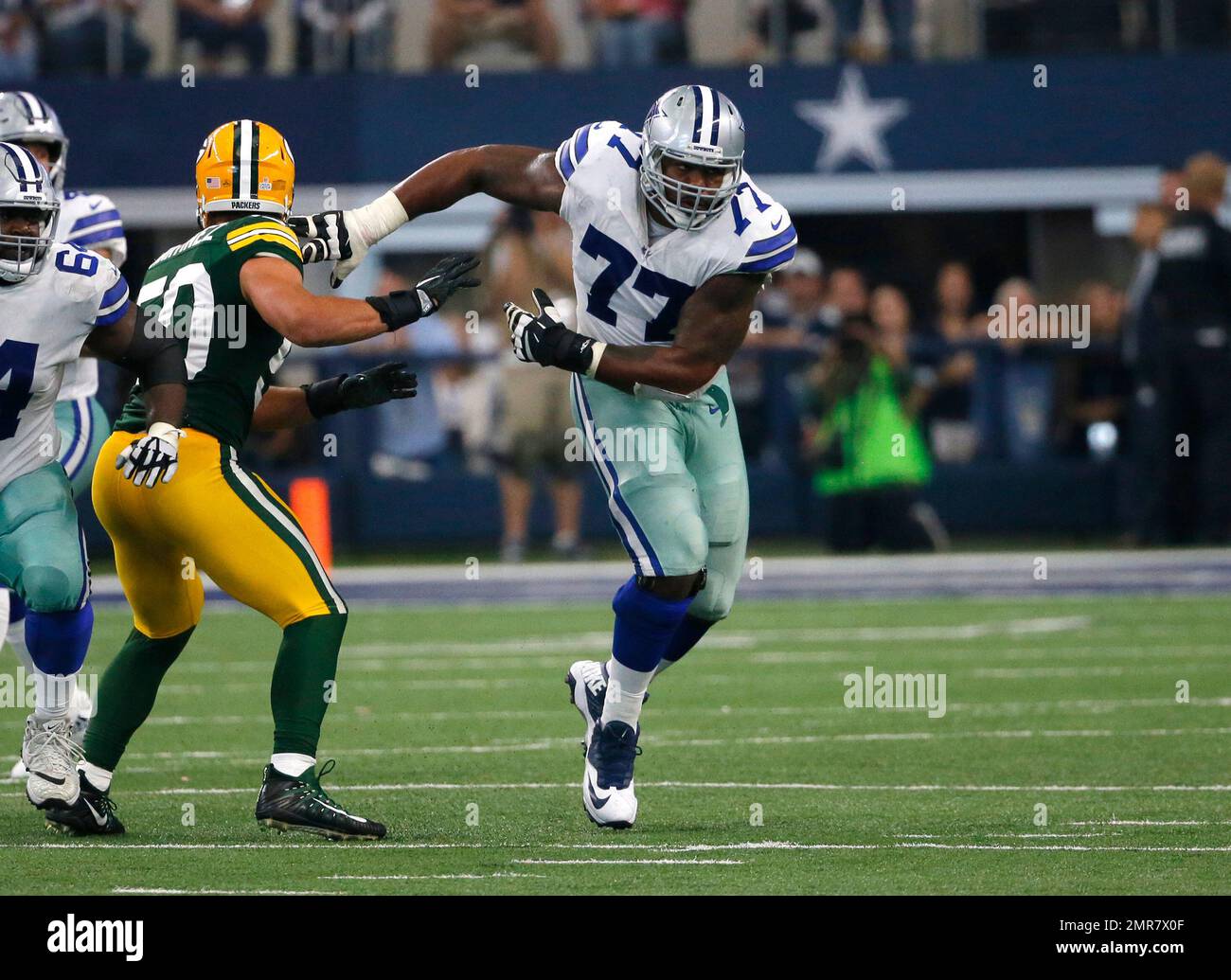Dallas Cowboys offensive tackle Tyron Smith (77) faces off against ...