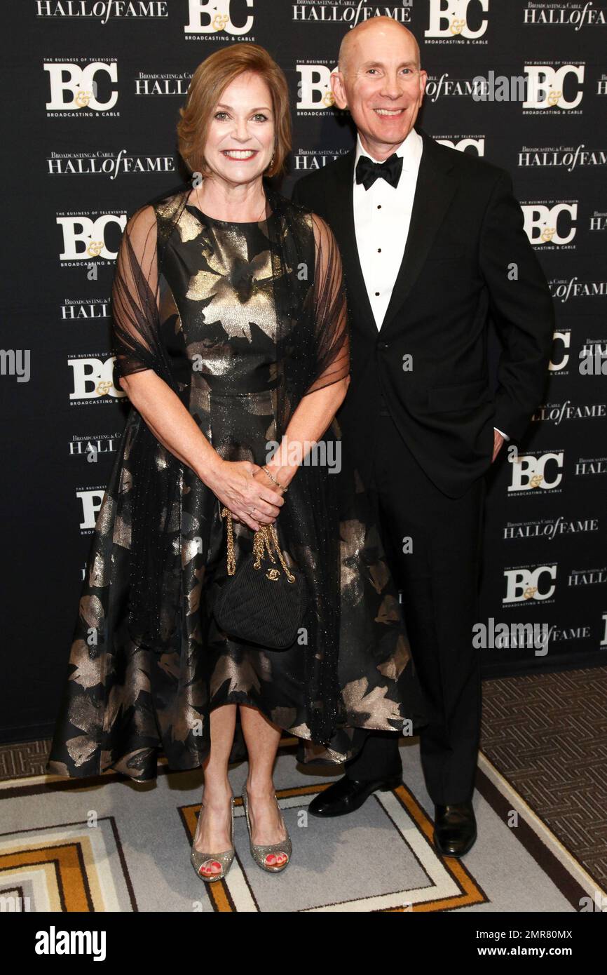 Susan Swain, left, and Rob Kennedy, right, pose in the press room at ...