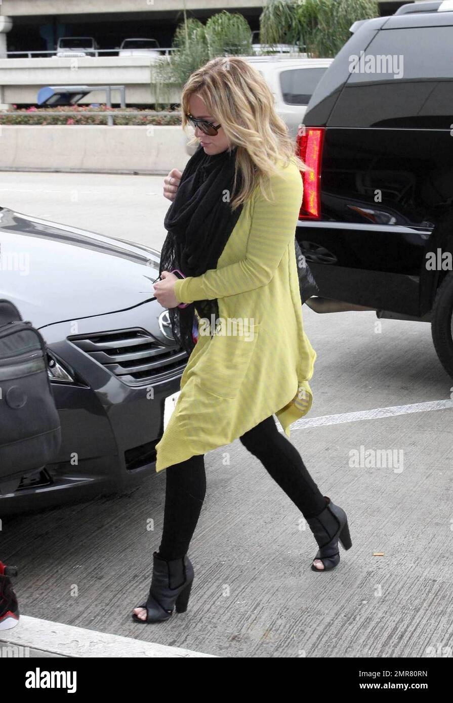 Hilary Duff was seen exiting a limo this afternoon at LAX for a flight ...