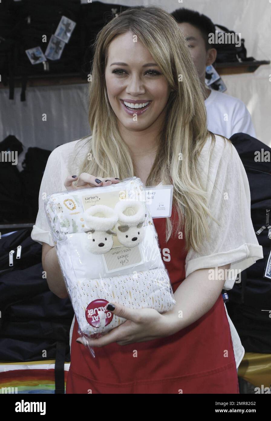 Hilary Duff receives a gift bag filled with baby items for her baby at ...