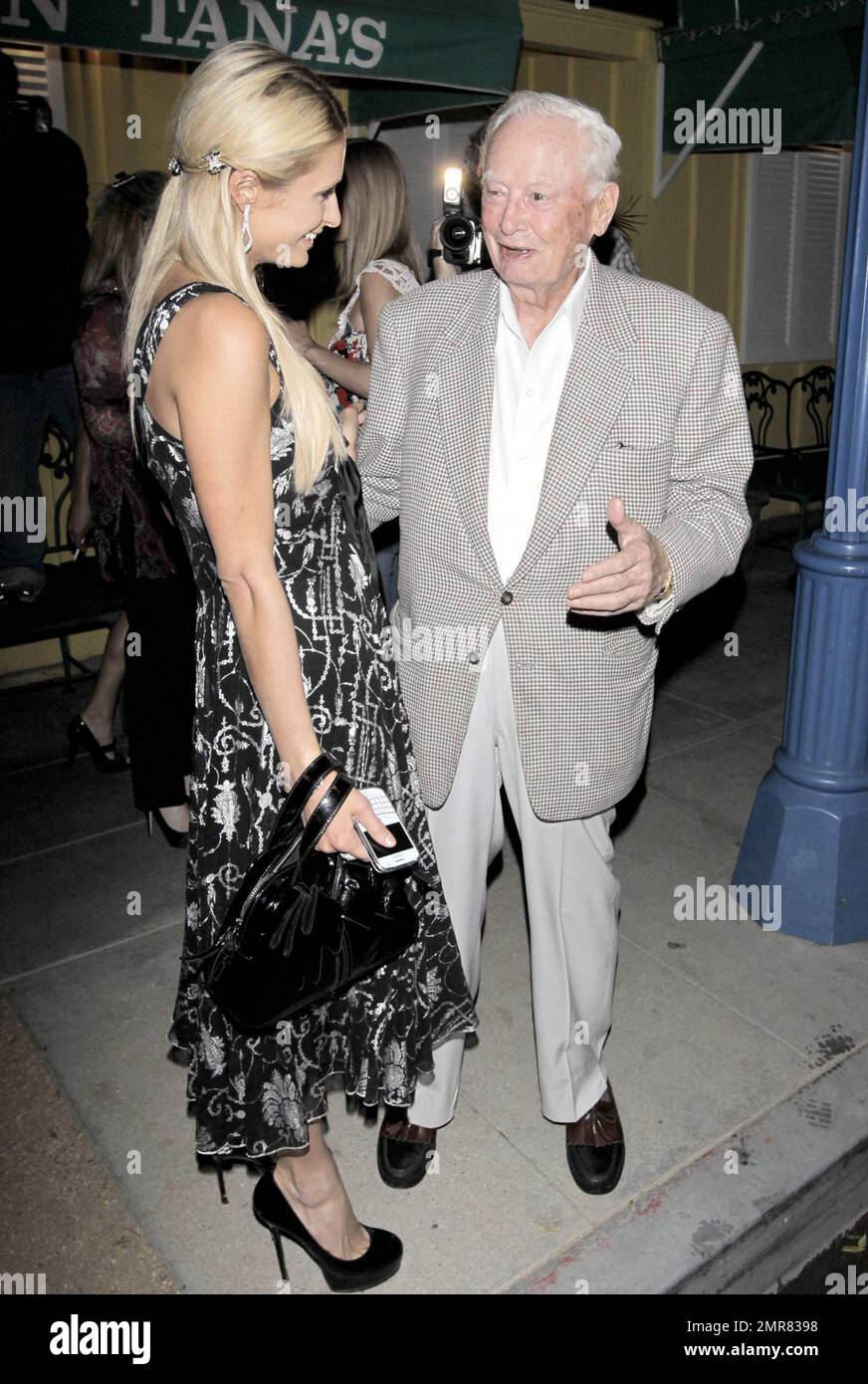 Paris Hilton is joined by her grandfather Barron Hilton, mom and dad ...