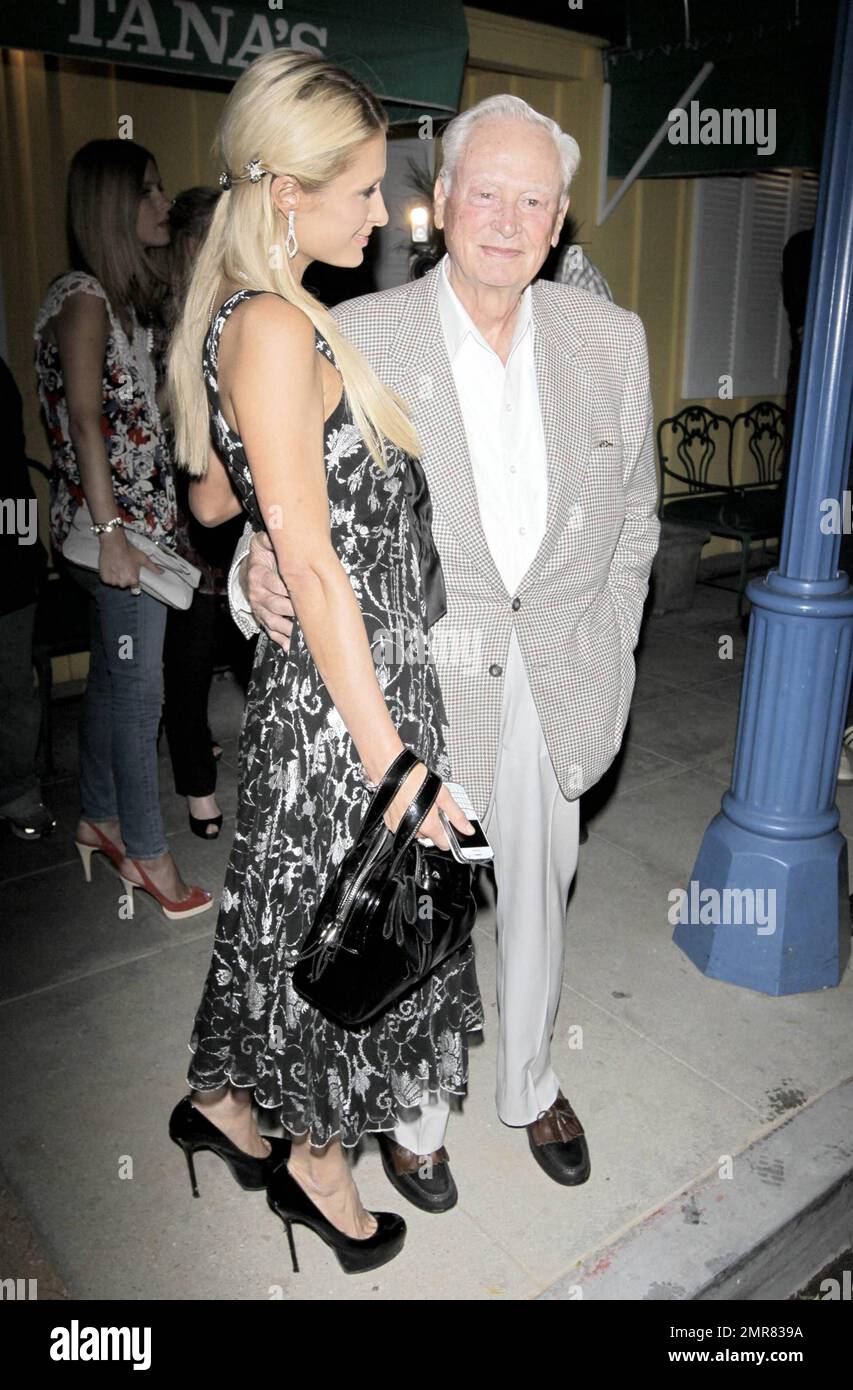 Paris Hilton is joined by her grandfather Barron Hilton, mom and dad ...
