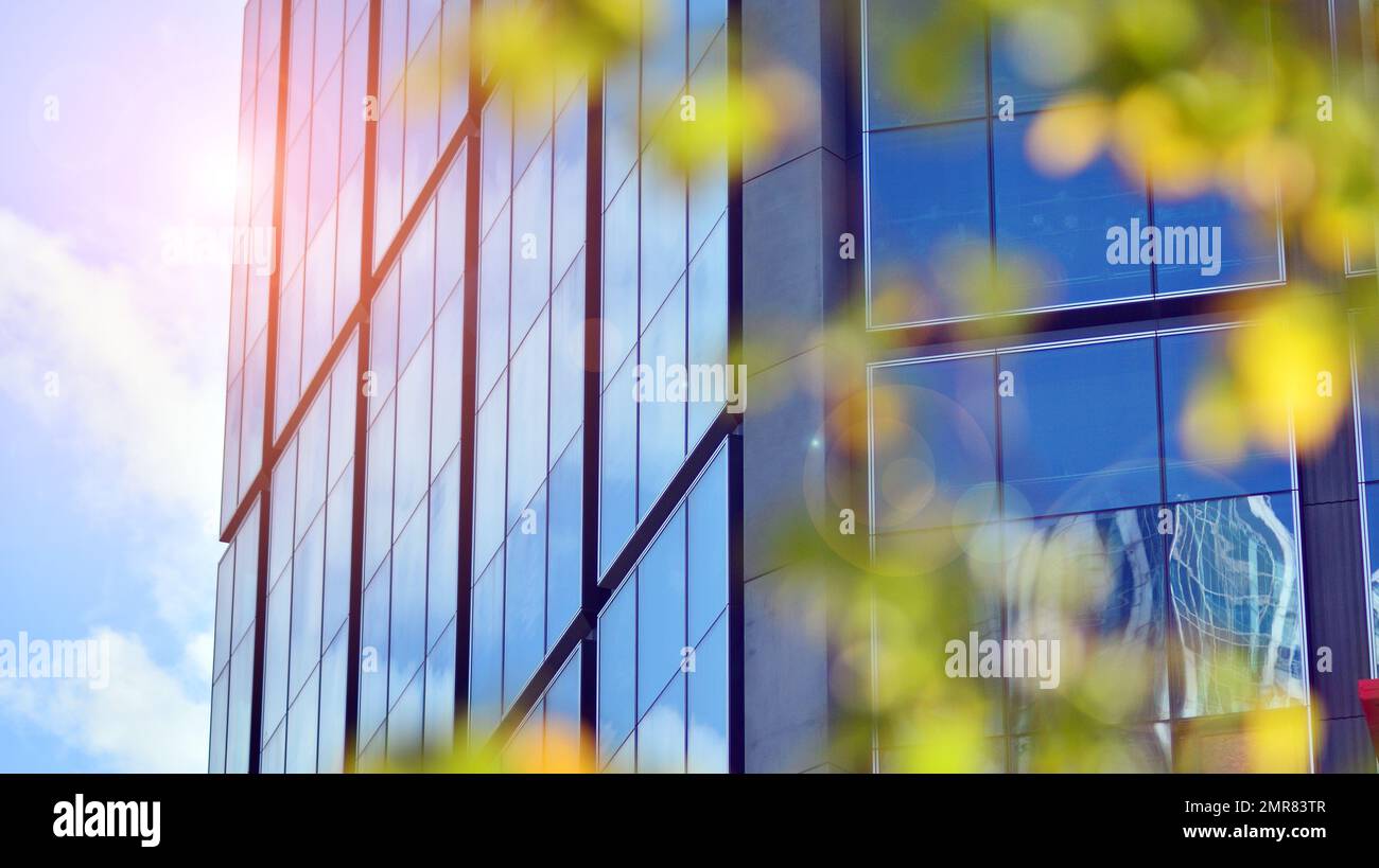 Abstract closeup of the glass-clad facade of a modern building covered ...