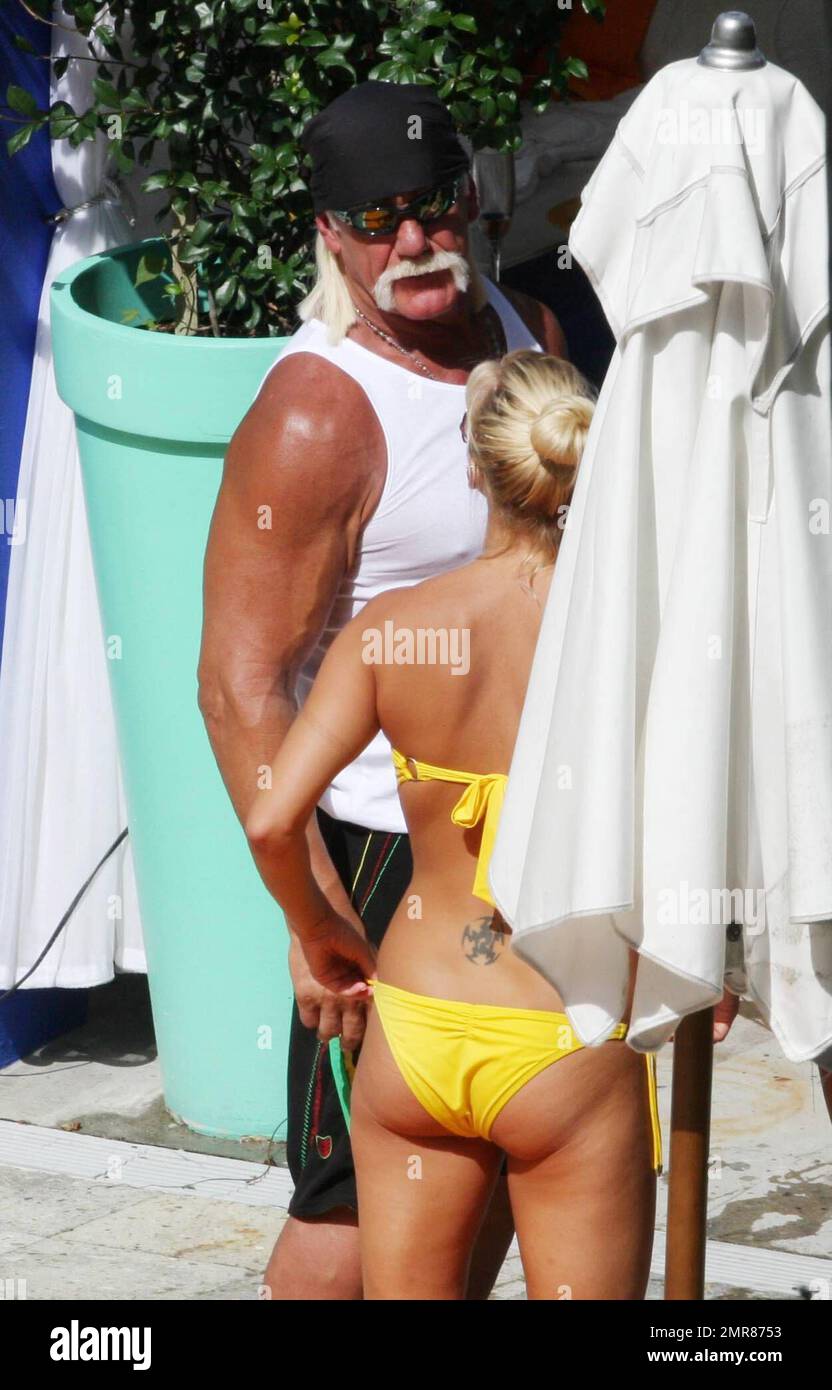 Exclusive!! Hulk Hogan's girlfriend Jennifer McDaniel soaks up the sun poolside in a bright ...