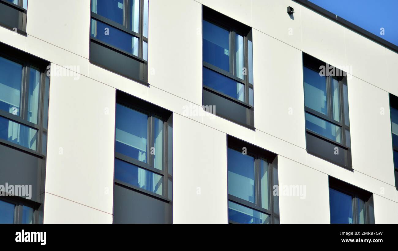 Futuristic square architecture of apartment building. Real estate with ...
