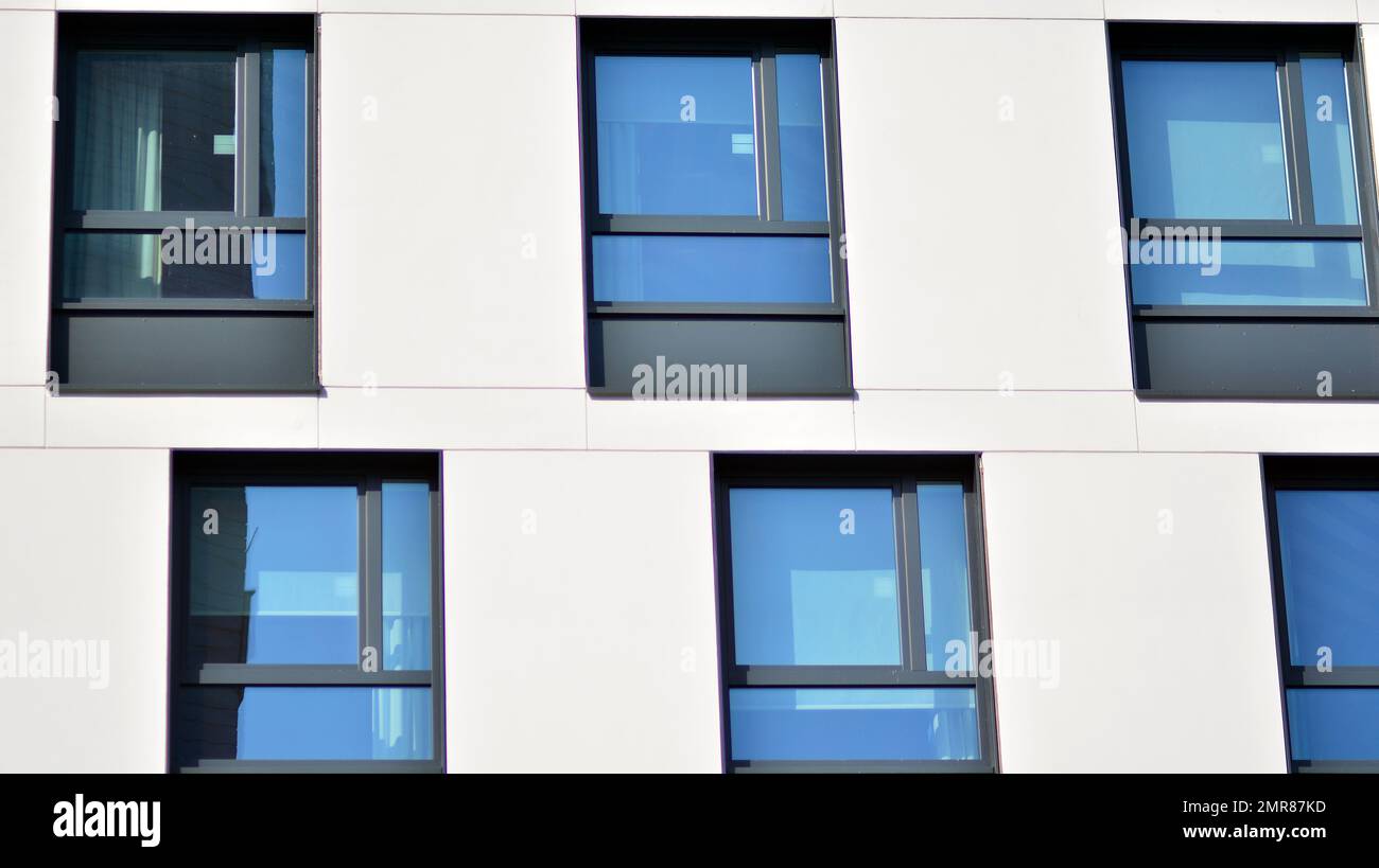 Futuristic square architecture of apartment building. Real estate with ...