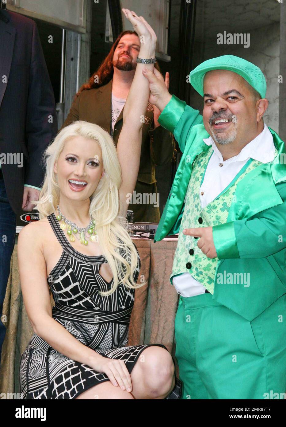 In a cutaway geometric patterned dress that shows off her curves Holly ...