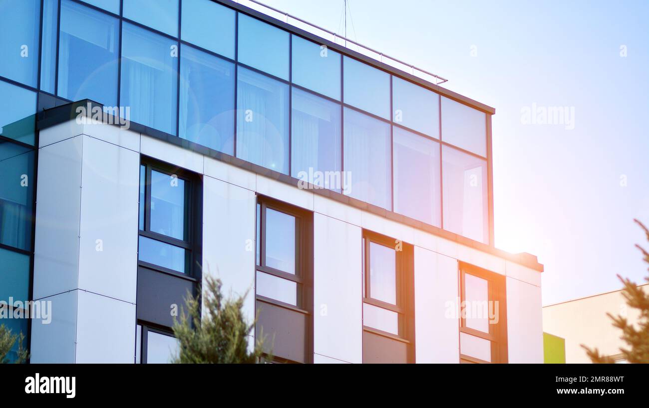 Abstract closeup of the glass-clad facade of a modern building covered ...