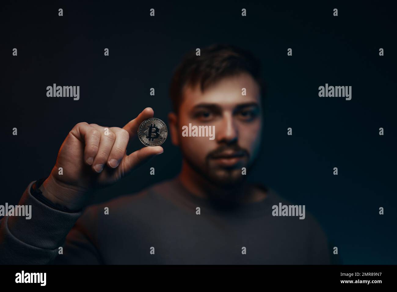 Man holding bitcoin. Financial ecosystem. The currency of the future ...