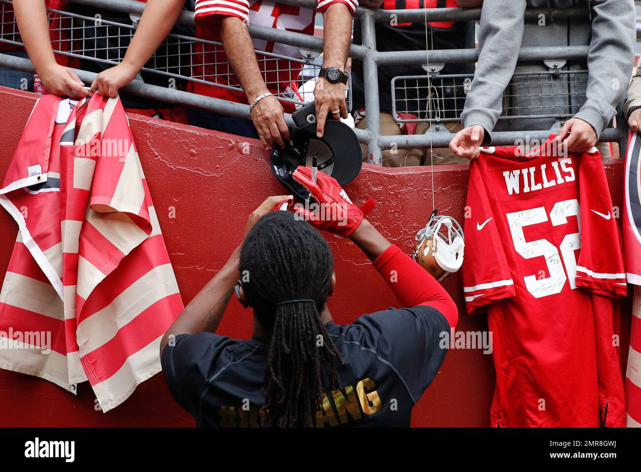 Washington Redskins defensive back Joshua Holsey (38) signs autographs ...