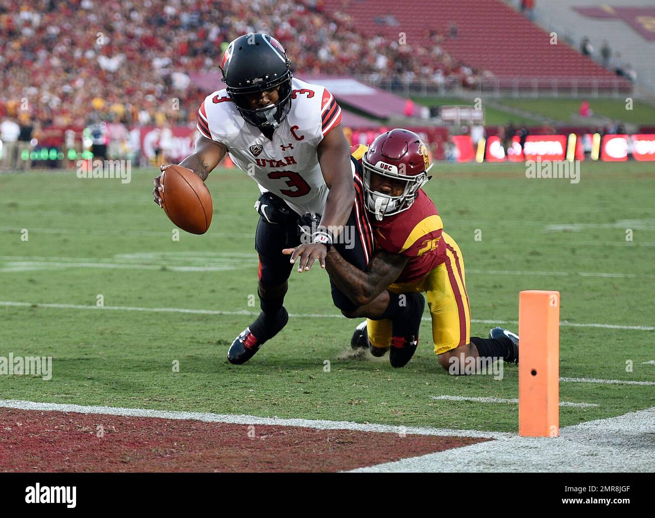 Utah quarterback Troy Williams, left, scores a touchdown while Southern ...