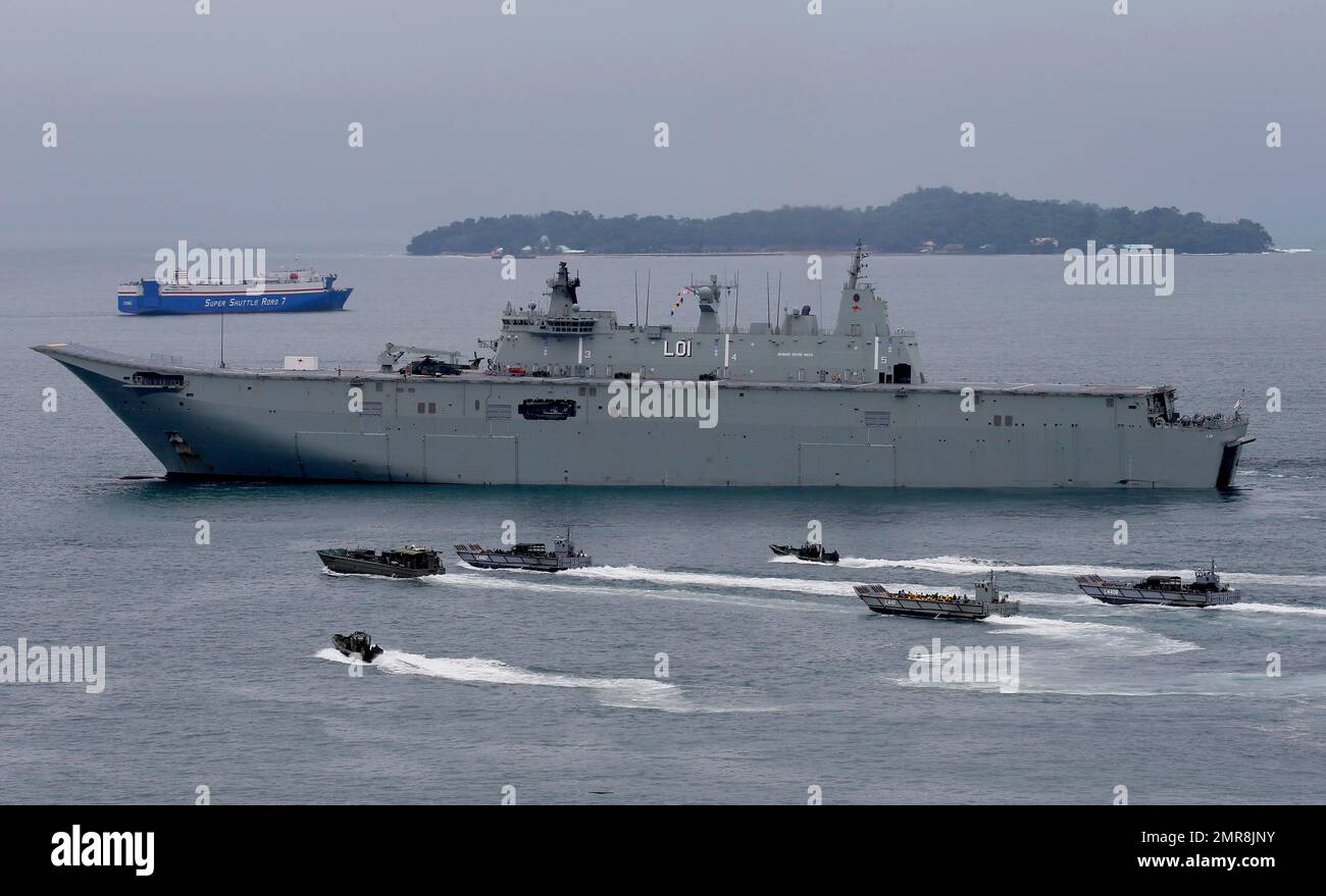 The Royal Australian Navy HMAS Adelaide crueses alongside landing ...