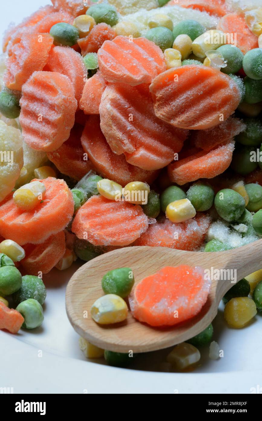 Frozen vegetables with cooking spoon, frozen food Stock Photo - Alamy