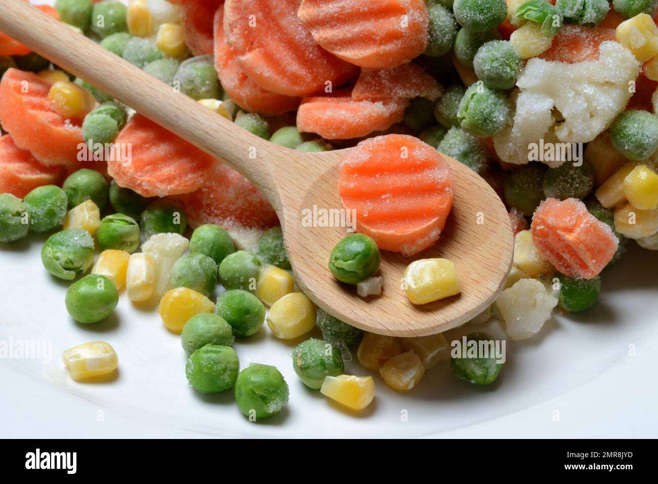 Frozen vegetables with cooking spoon, frozen food Stock Photo - Alamy