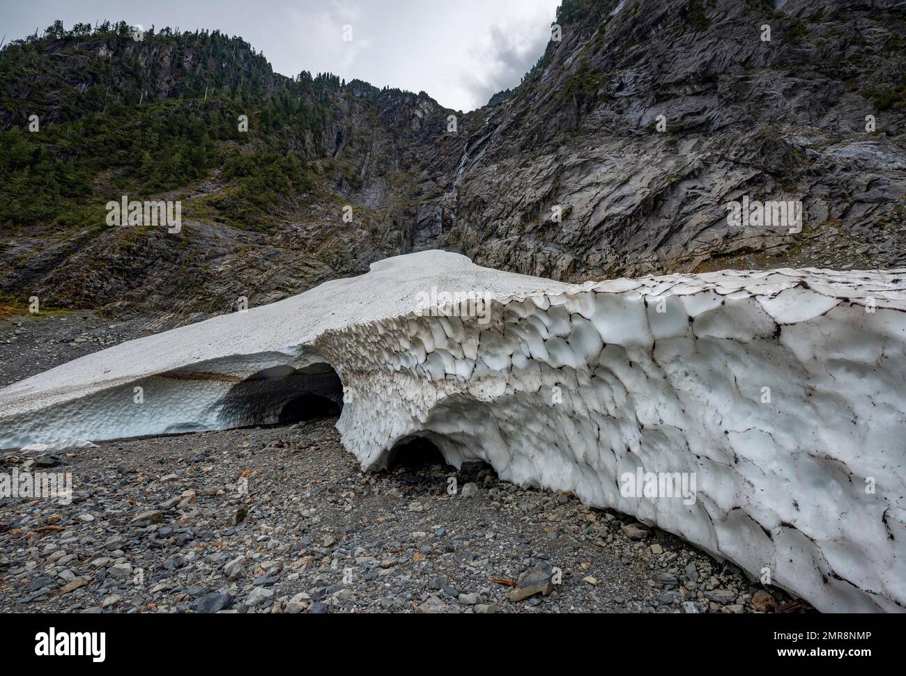Entrance of an ice cave of a glacier, Big Four Ice Caves, Okanogan ...