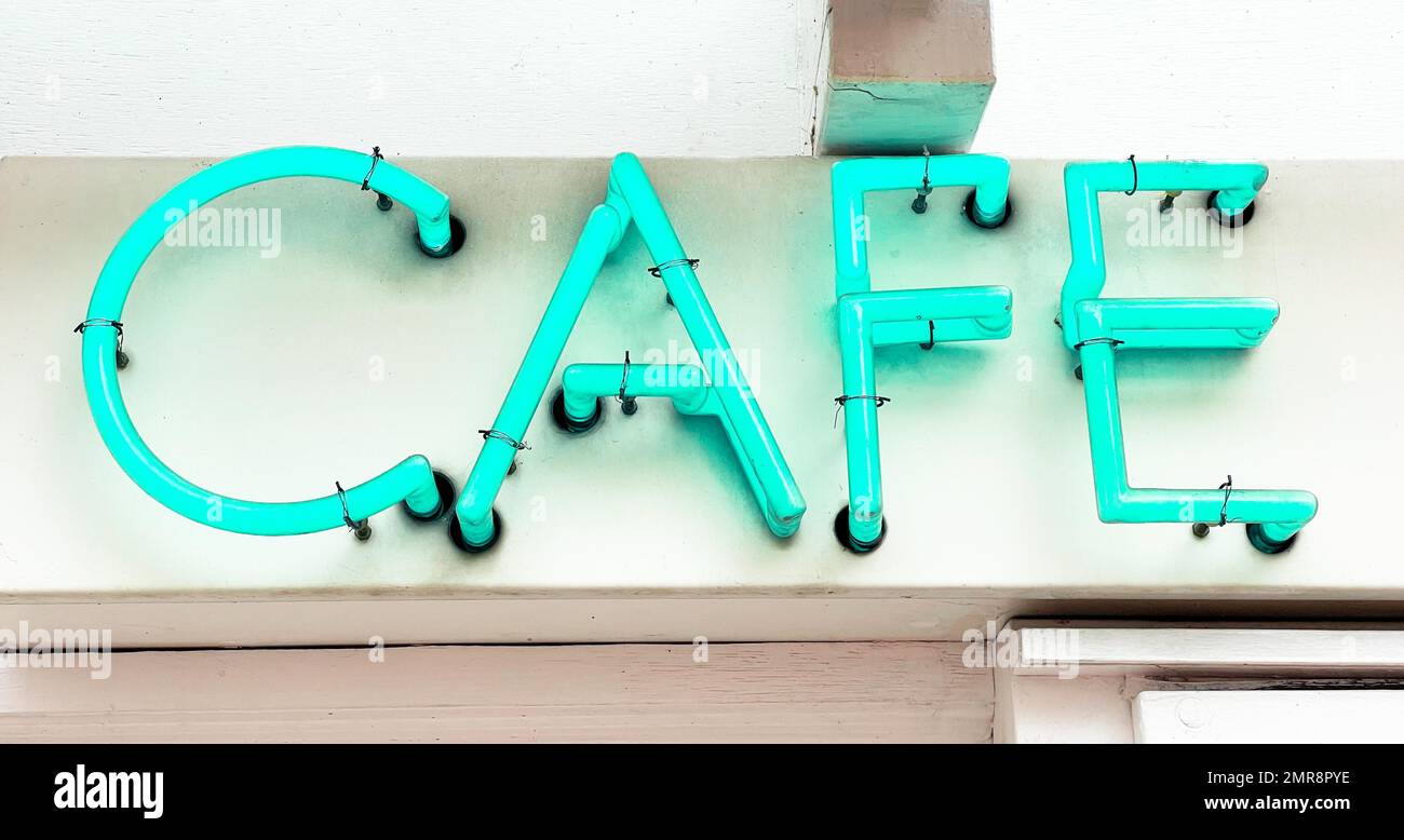 cafe neon sign in blue green during daytime Stock Photo - Alamy