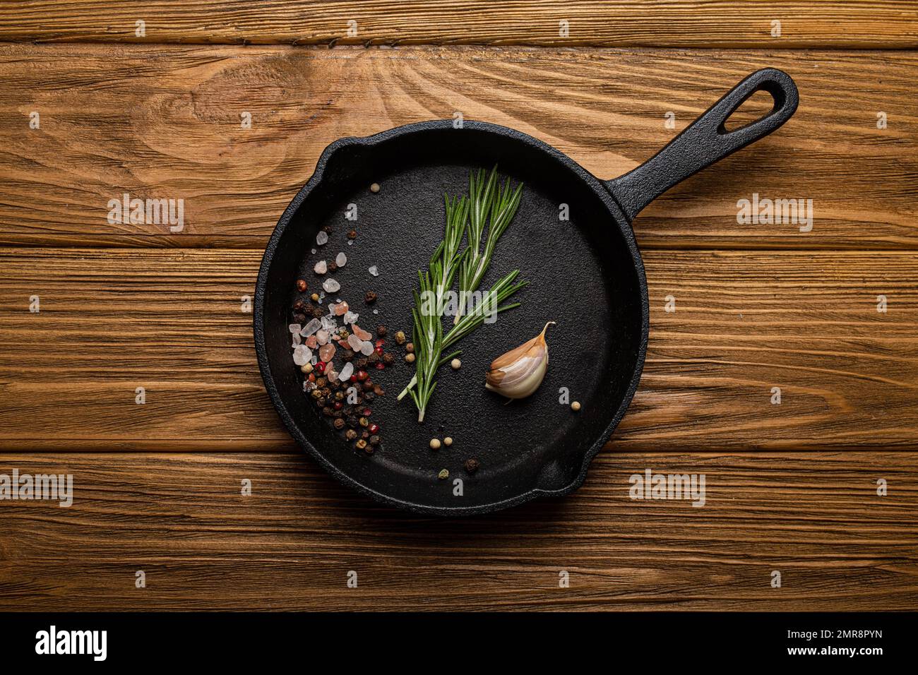 Black cast iron frying pan skillet with food cooking ingredients fresh ...