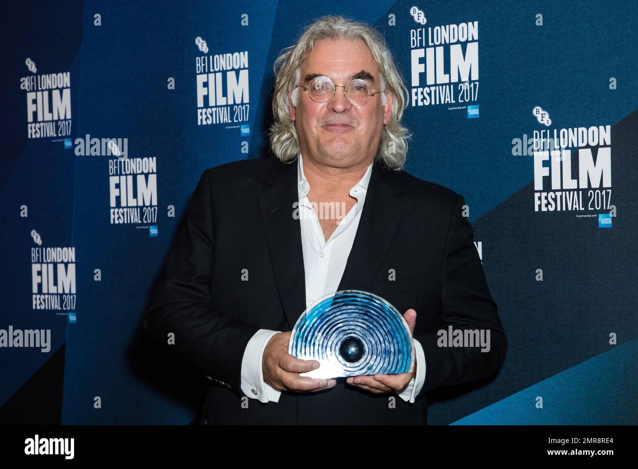 Director Paul Greengrass poses for photographers after receiving the ...