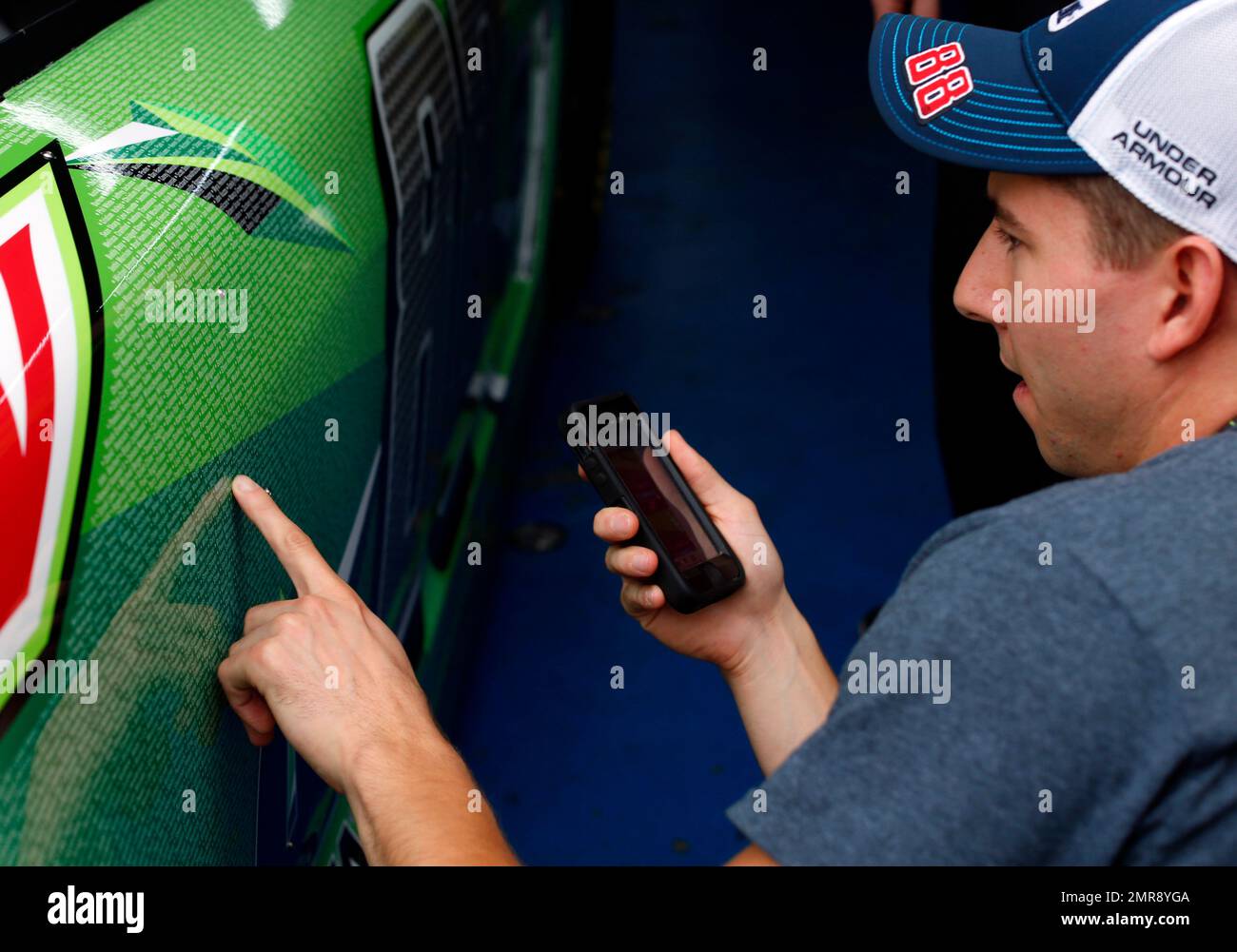 Zach Grafe, of Pittsburgh, looks for his name on NASCAR Cup Series ...