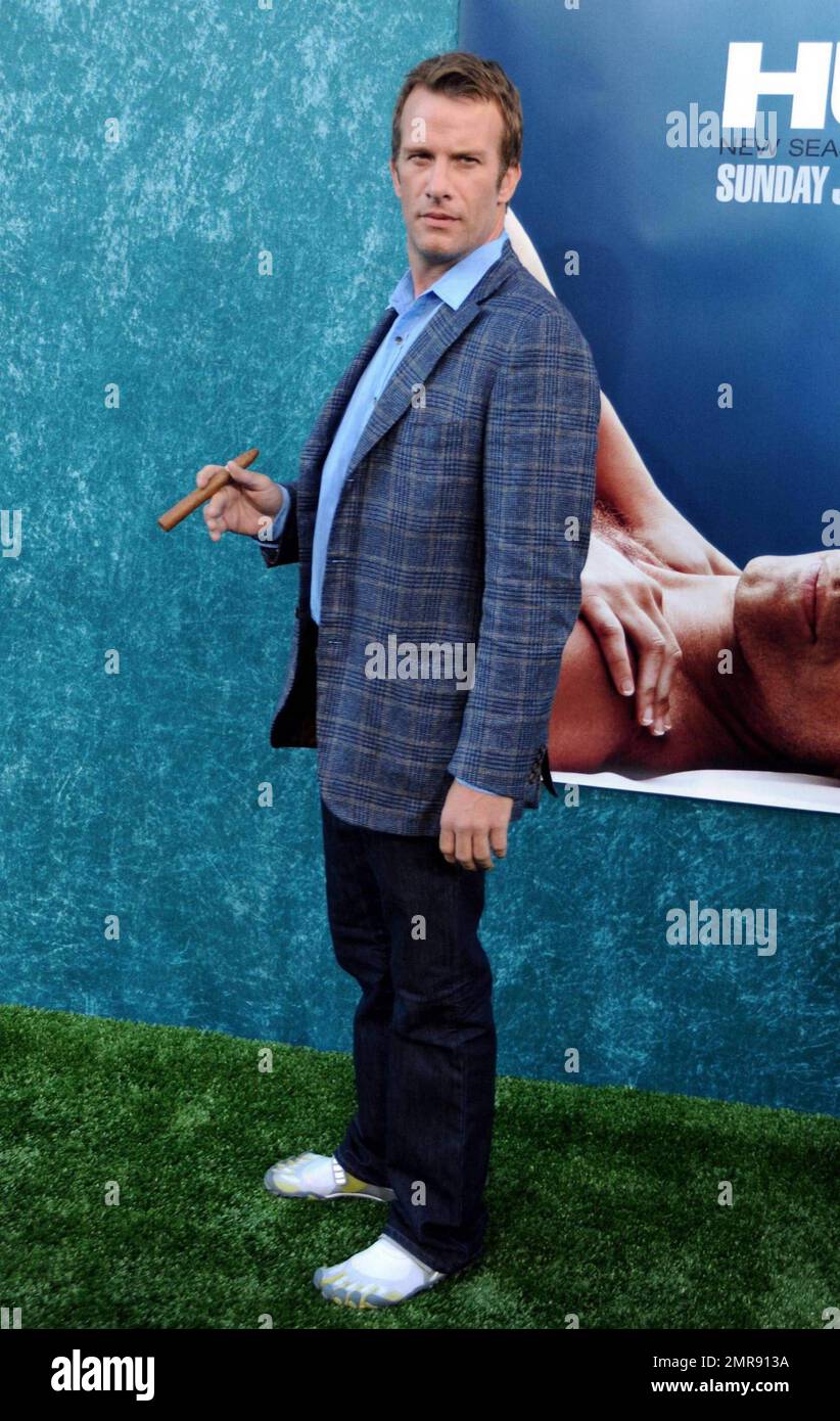 Actor Thomas Jane, wearing a pair of Vibram FiveFingers shoes, arrives ...