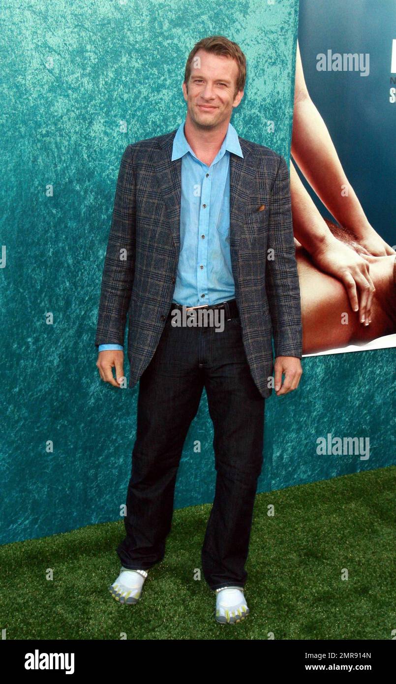 Actor Thomas Jane, wearing a pair of Vibram FiveFingers shoes, arrives ...