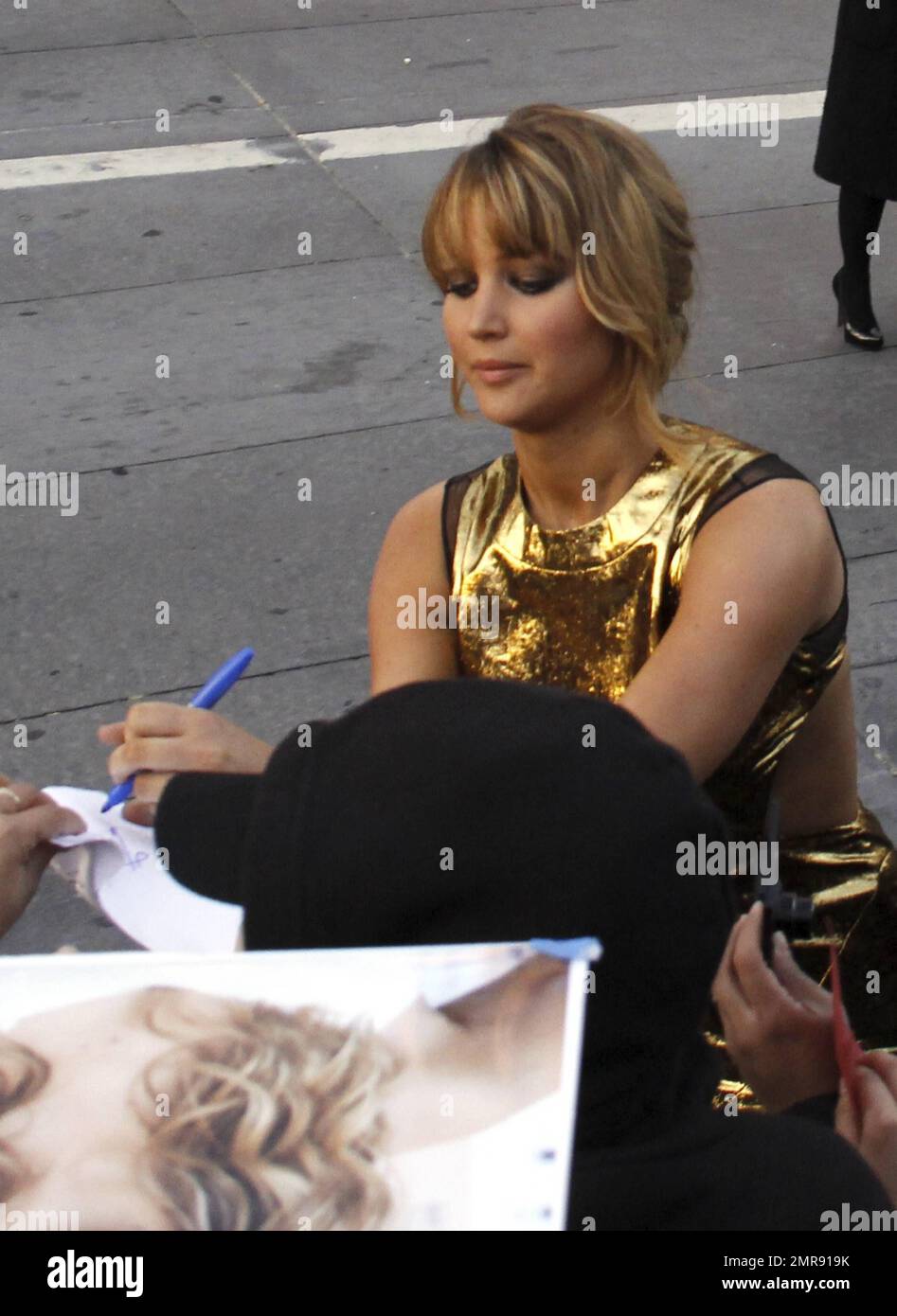 Jennifer Lawrence arrives at the premiere of "The Hunger Games" held at ...