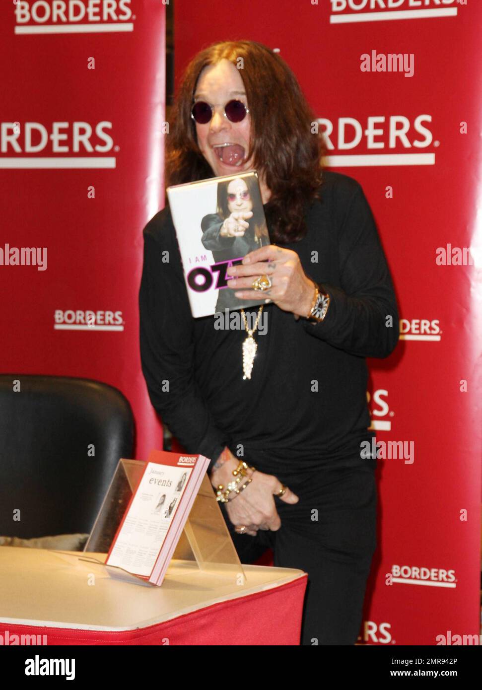 Ozzy Osbourne signs copies of his book "I Am Ozzy" at Borders Books ...