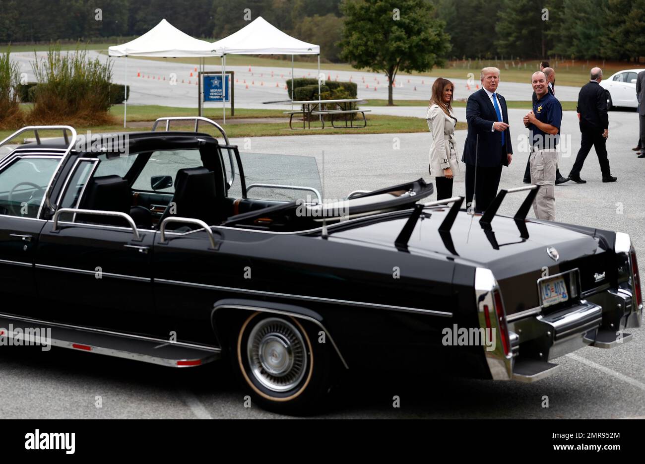 President Donald Trump and first lady Melania Trump look at a 1983 ...