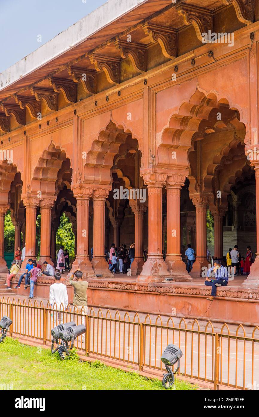 A vertical shot of tourists and ancient buildings inside the Red Fort ...