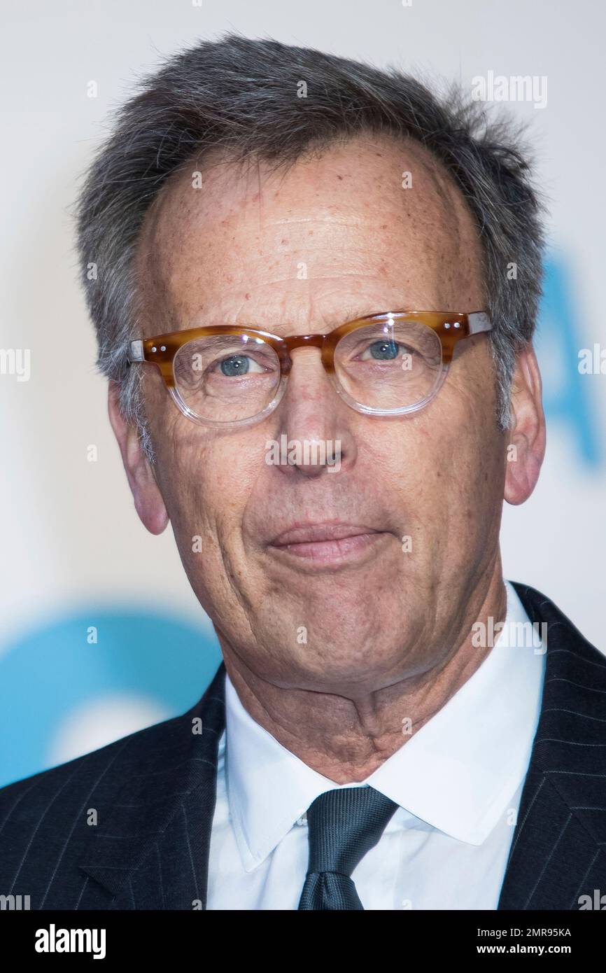 Mark Johnson poses for photographers upon arrival at the premiere of ...
