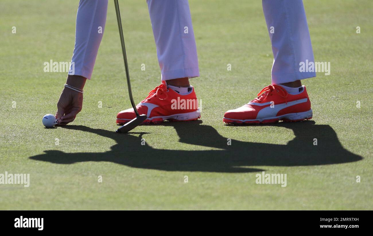 Lexi Thompson of the United States places her ball marker on the green ...